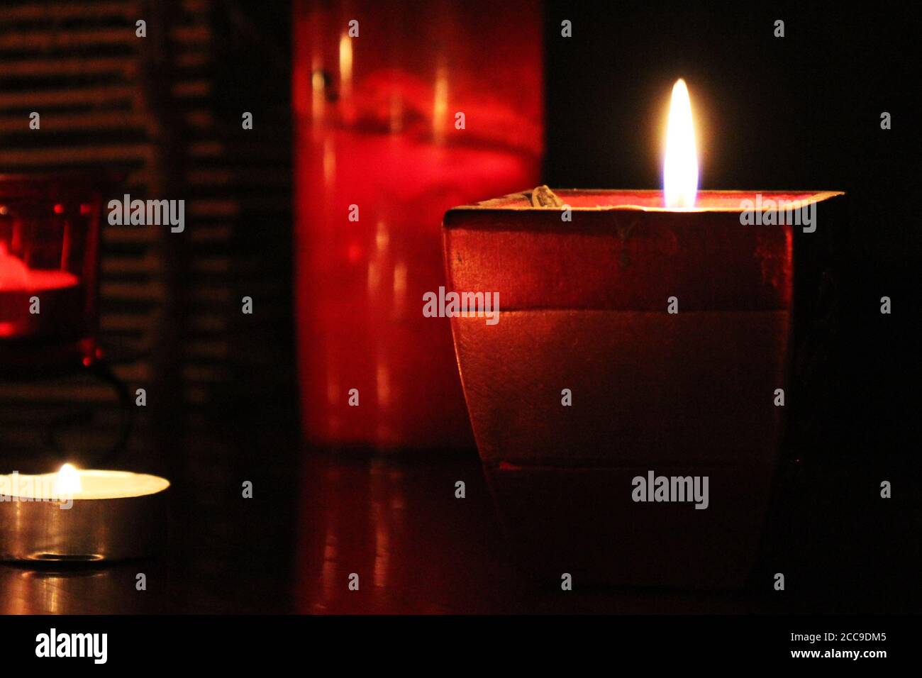 Red candle lights on the dark background, romantic scenery Stock Photo ...