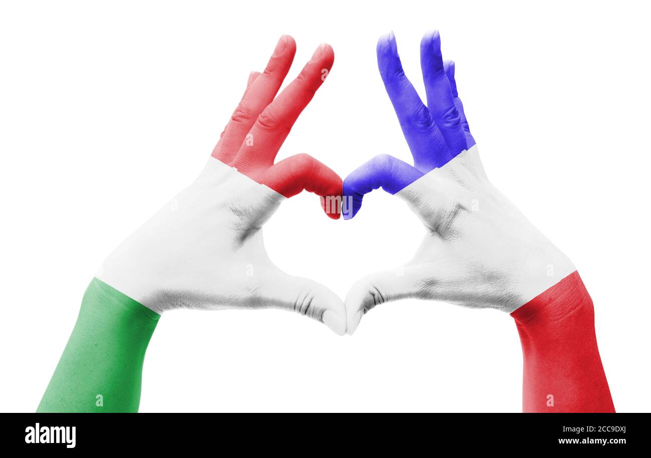 A person's hands forming a heart with the flags of Italy and France ...