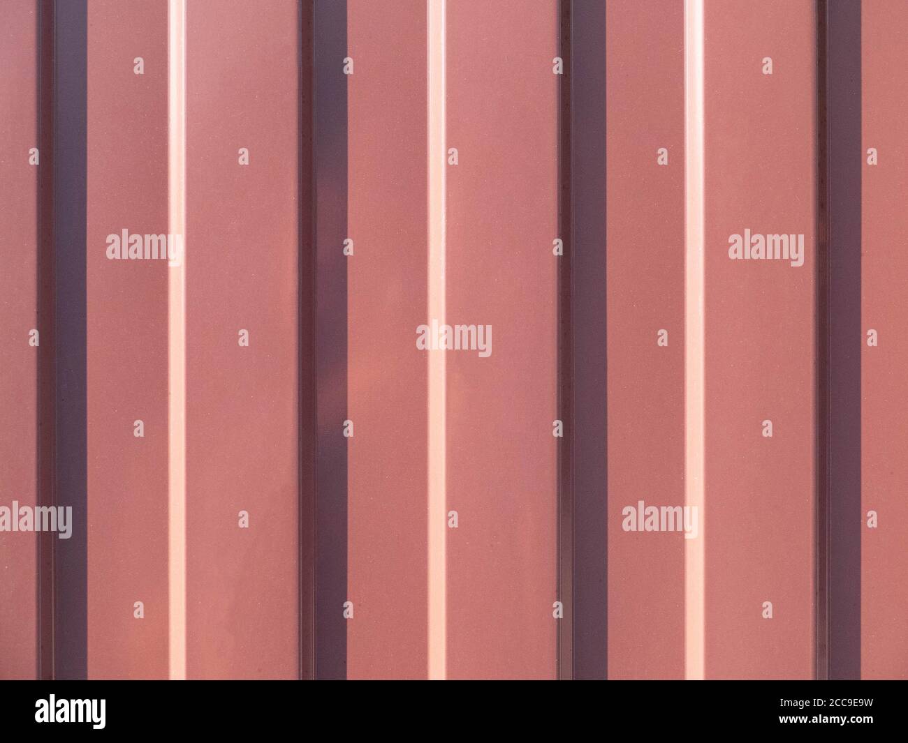 Stainless brown colored galvanized profiled sheet. Background or ...