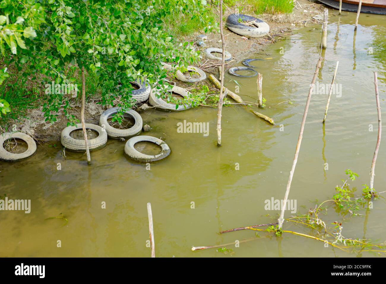 Improvised dock, place for docking fishing boats on shore Stock Photo ...