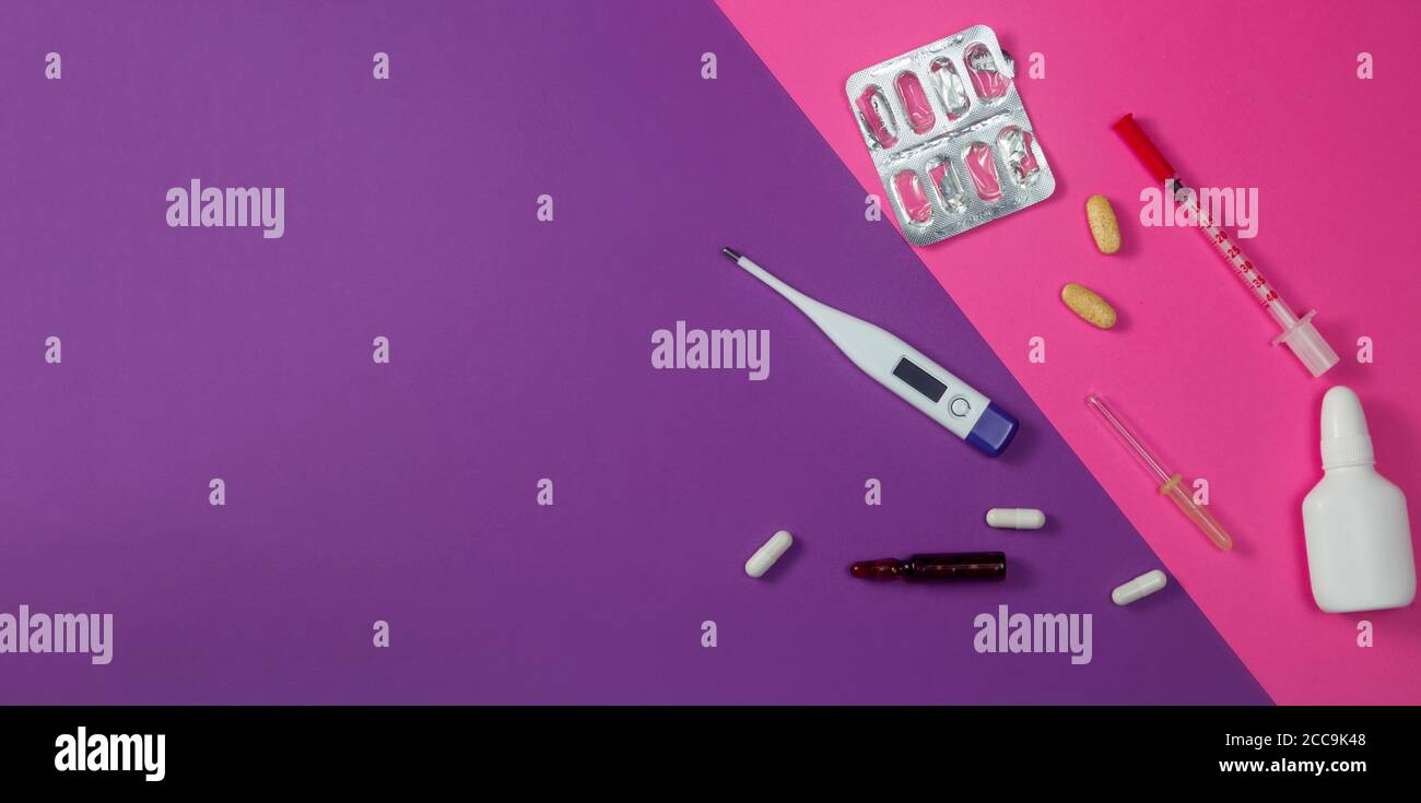 Cold medicines on pink and violet color background banner Stock Photo ...