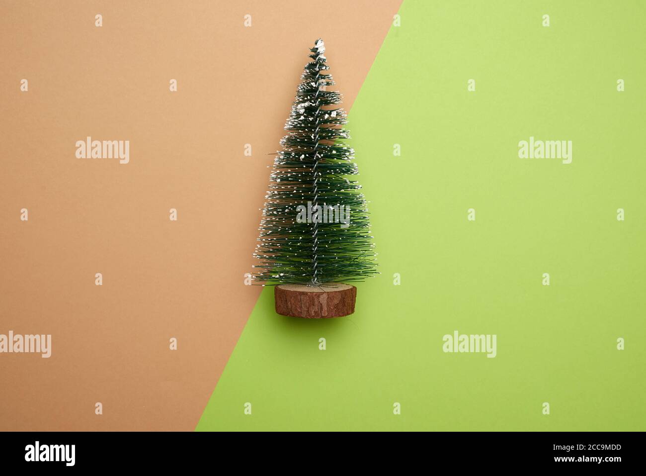 christmas decor green tree on colored surface, minimalism, top view ...