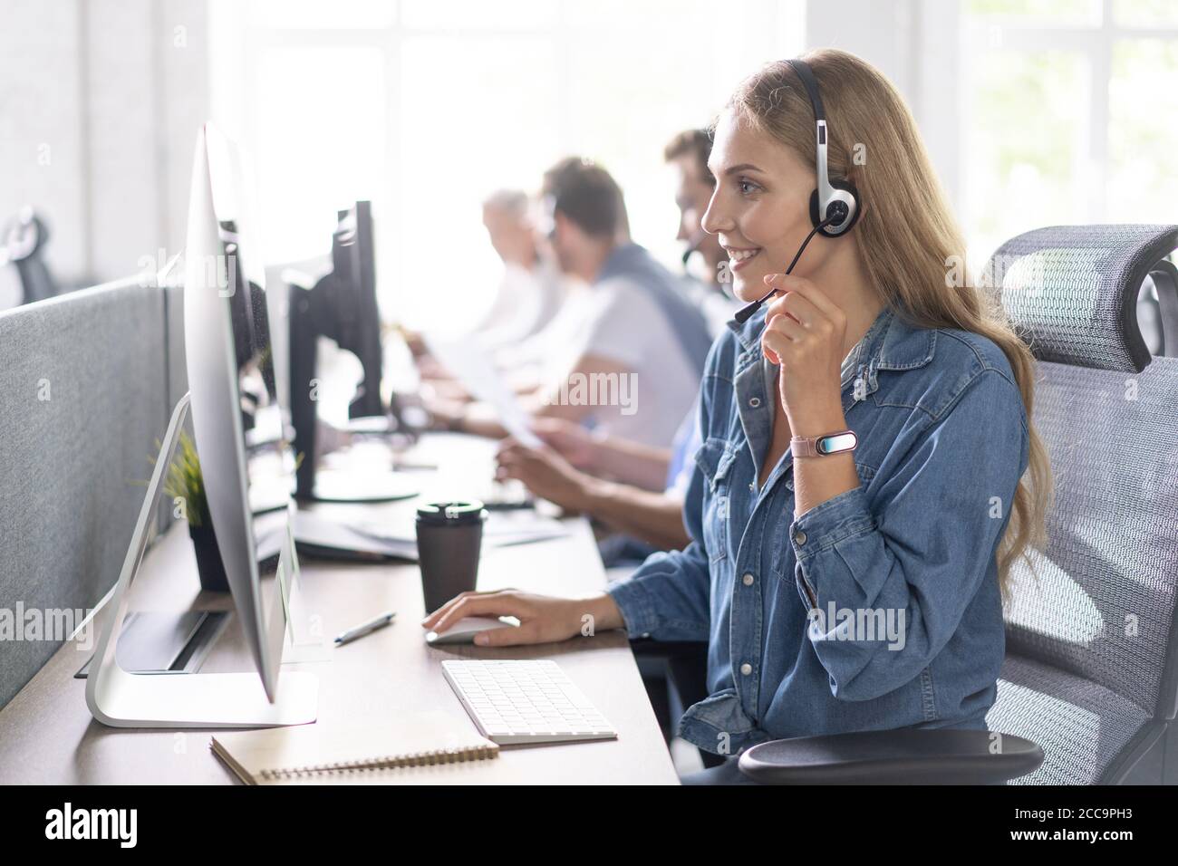 How can I help you Beautiful call center workers in headphones are ...