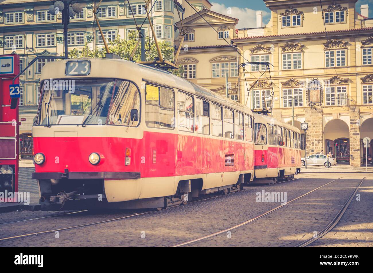 Typical old retro vintage tram on tracks near tram stop in the streets ...