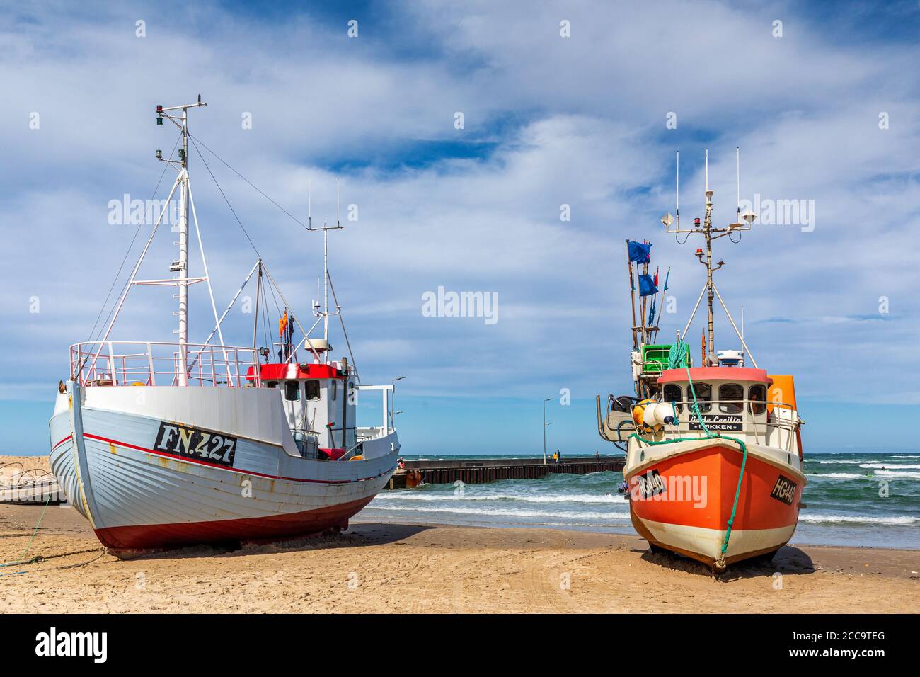 Small traditional and colorful Danish fishing boats on the beach ...