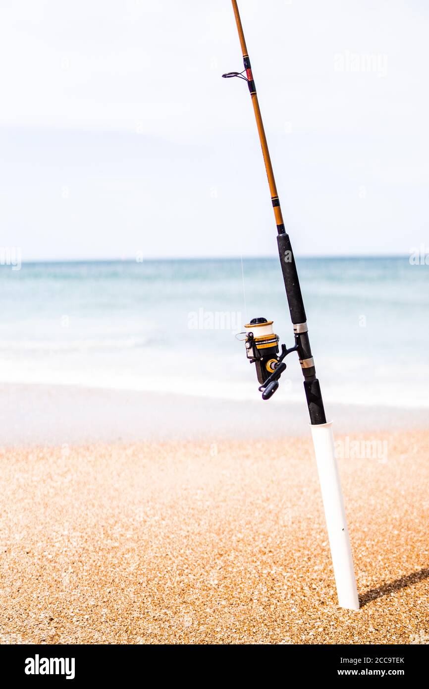 Relaxing and Fishing at the Beach Stock Photo - Alamy