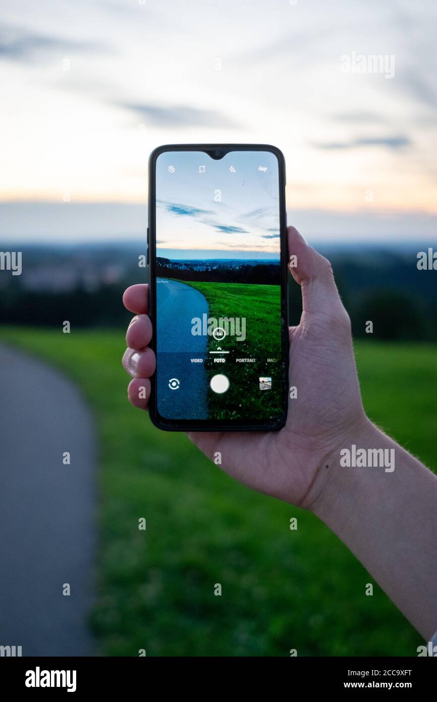 Blurry Background with a Smartphone Stock Photo - Alamy