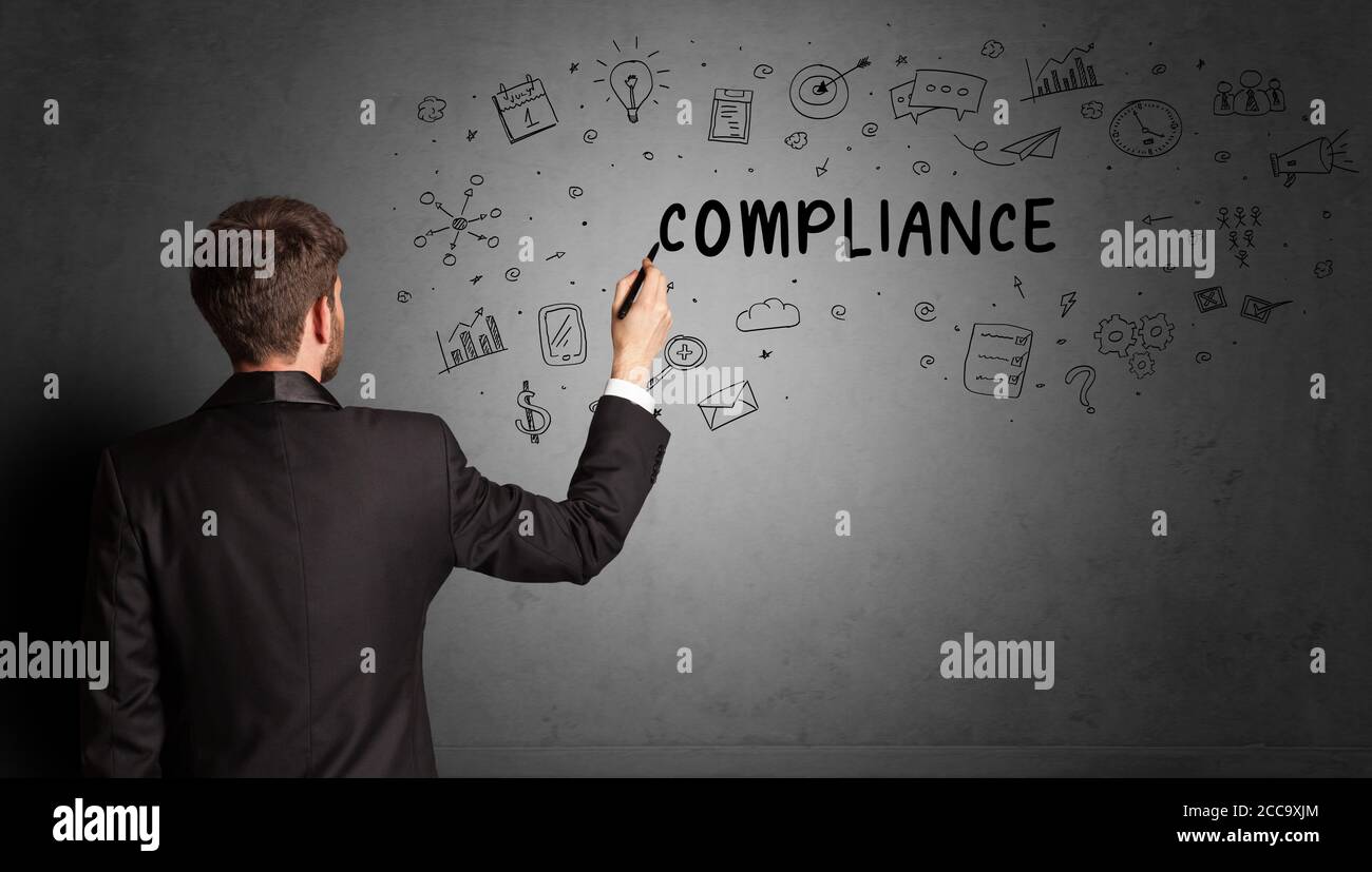 businessman drawing a creative idea sketch with COMPLIANCE inscription ...
