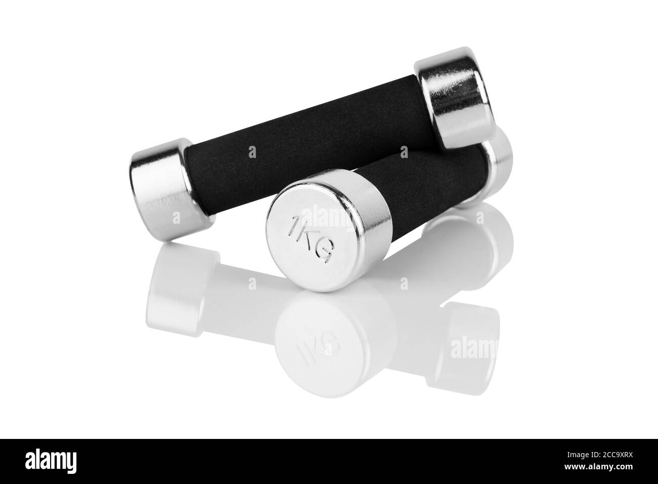 Two 1 kg dumbbells white background & reflection isolated close up ...