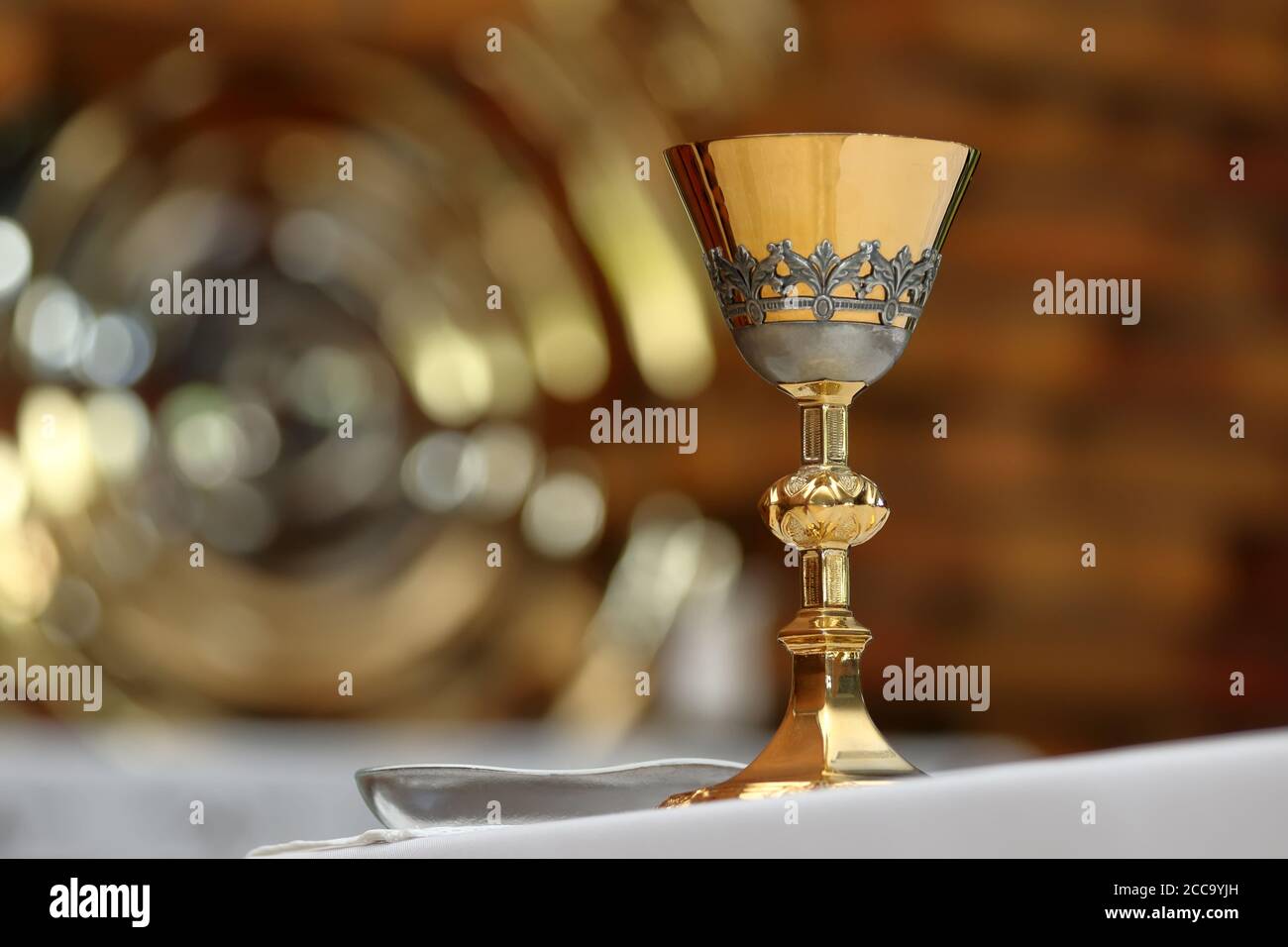 Chalice on the altar in church and empty space for text Stock Photo - Alamy