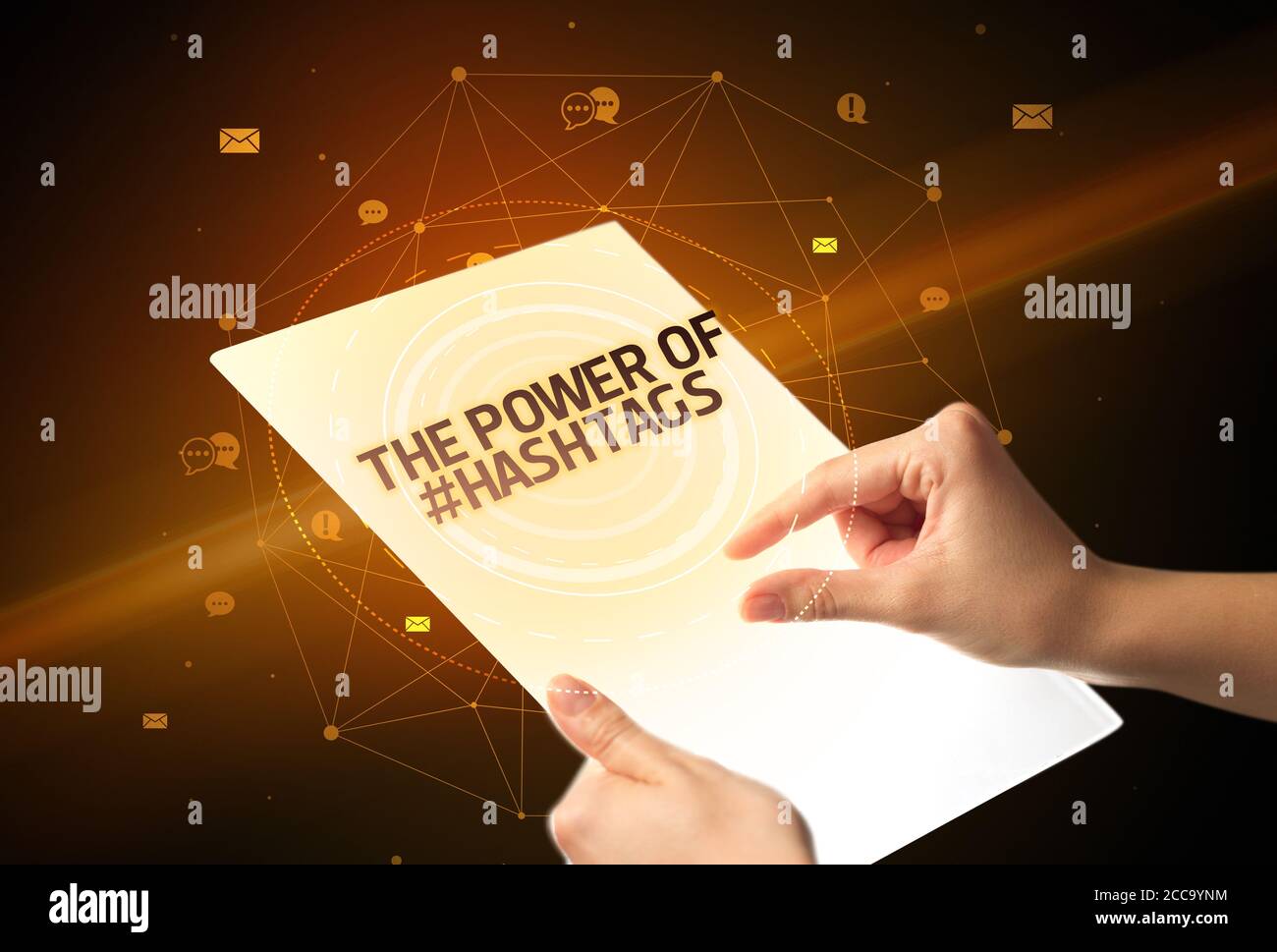 Holding futuristic tablet with THE POWER OF #HASHTAGS inscription ...