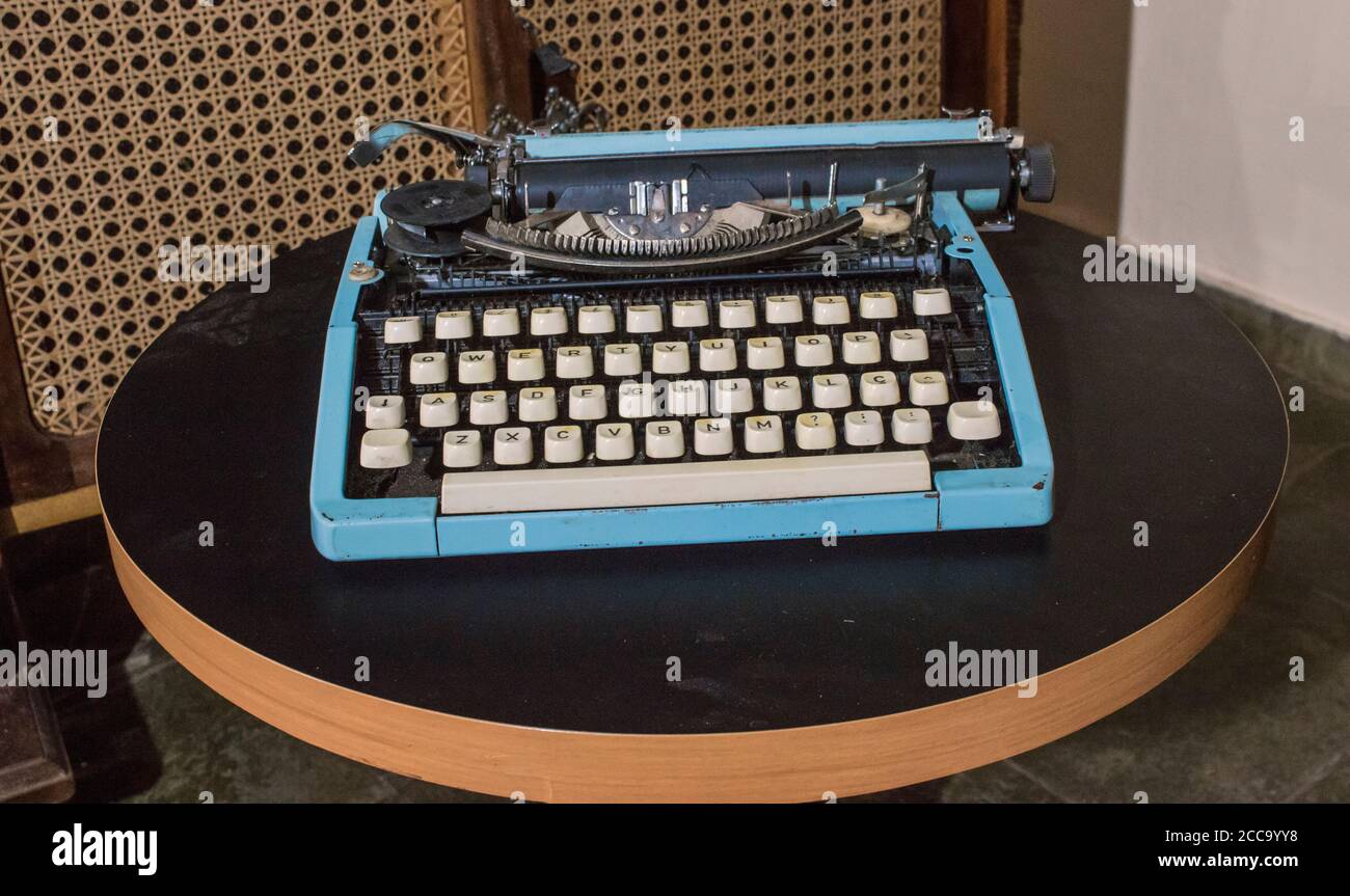 Old blue typewriter retro objects concept image Stock Photo - Alamy