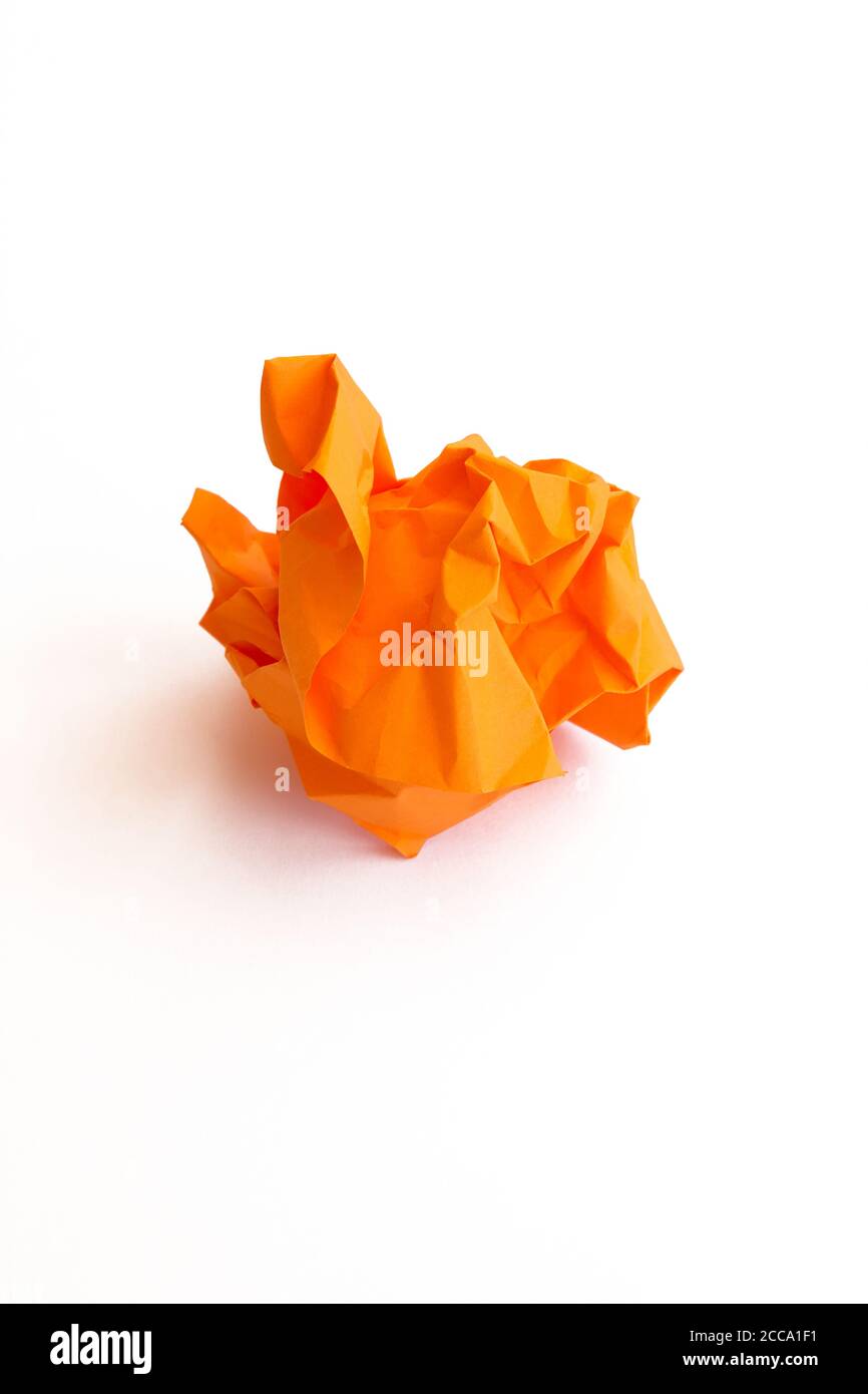Crumpled orange paper isolated on white. Vertical Stock Photo - Alamy