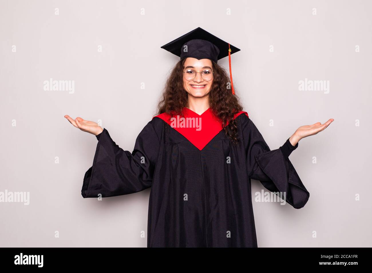 Young woman wearing graduation uniform very happy and excited, winner ...