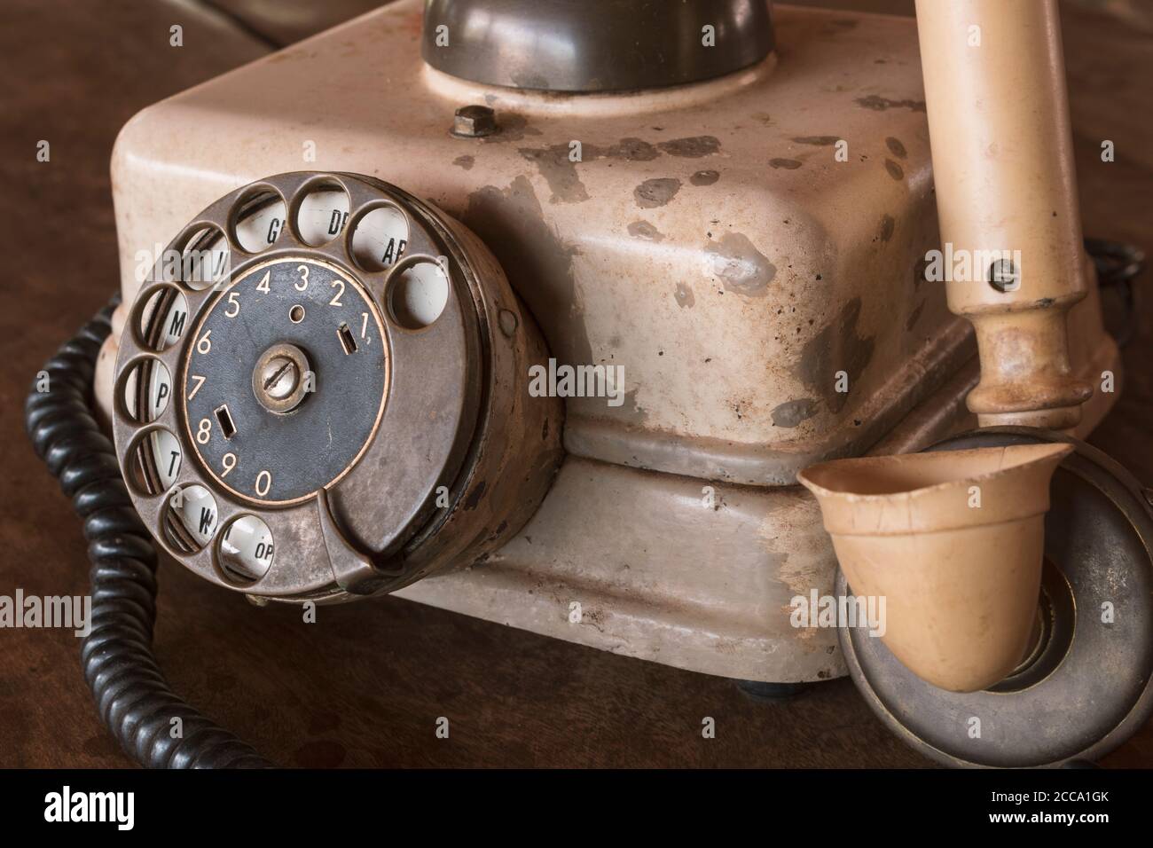 Old Beige phone retro on a wood table Stock Photo - Alamy