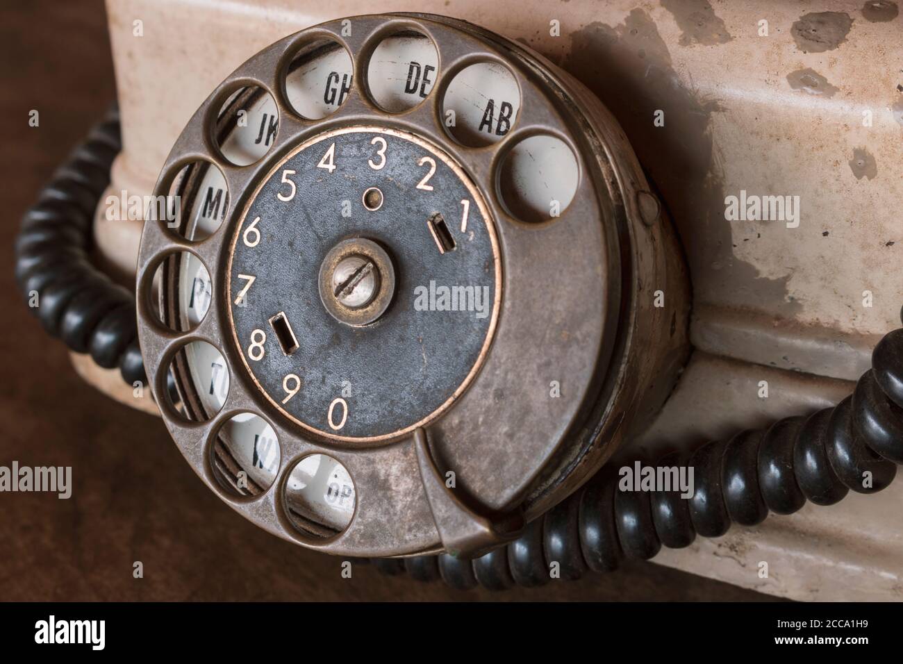 Old Beige phone retro on a wood table Stock Photo - Alamy