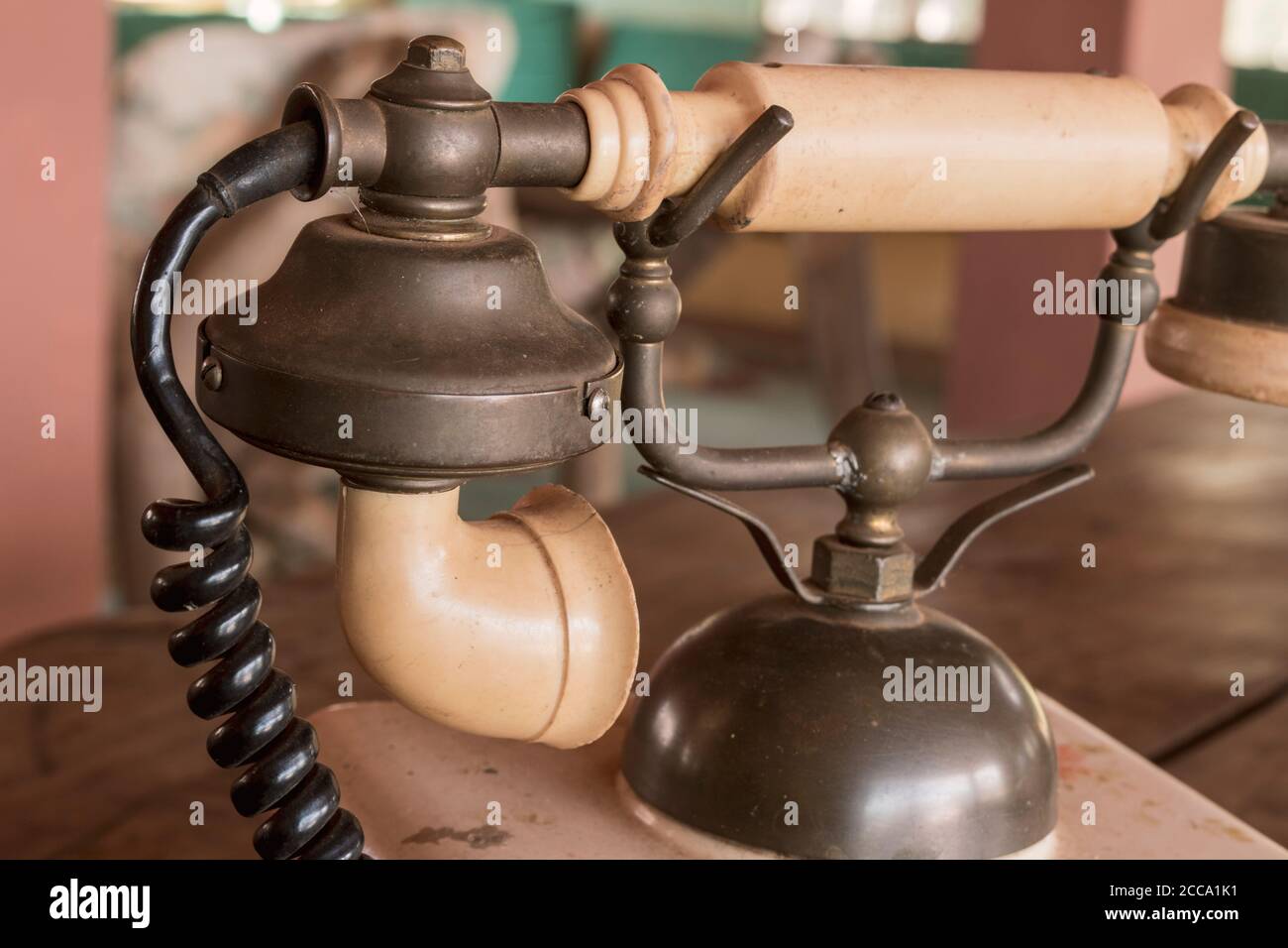 Old Beige phone retro on a wood table Stock Photo - Alamy