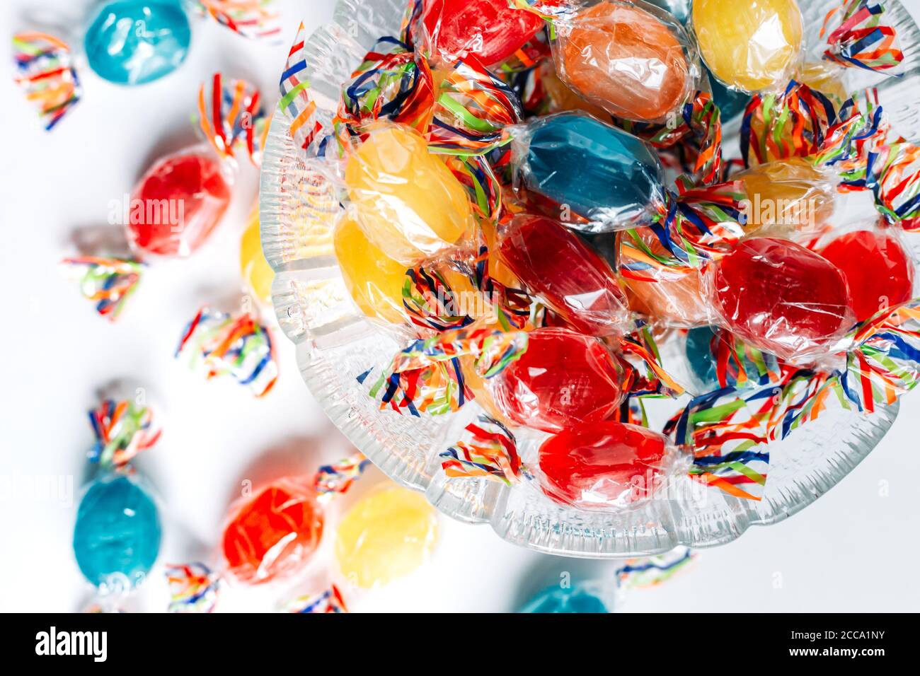 Bowl full with mix hard wrapped candies isolated on white background ...