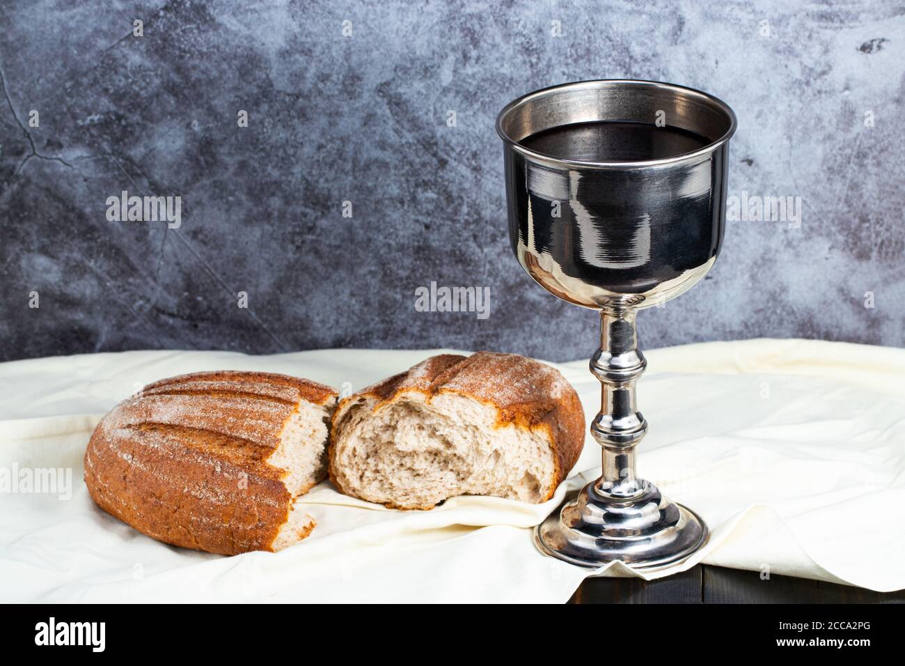 holy communion chalice with wine and bread Stock Photo - Alamy