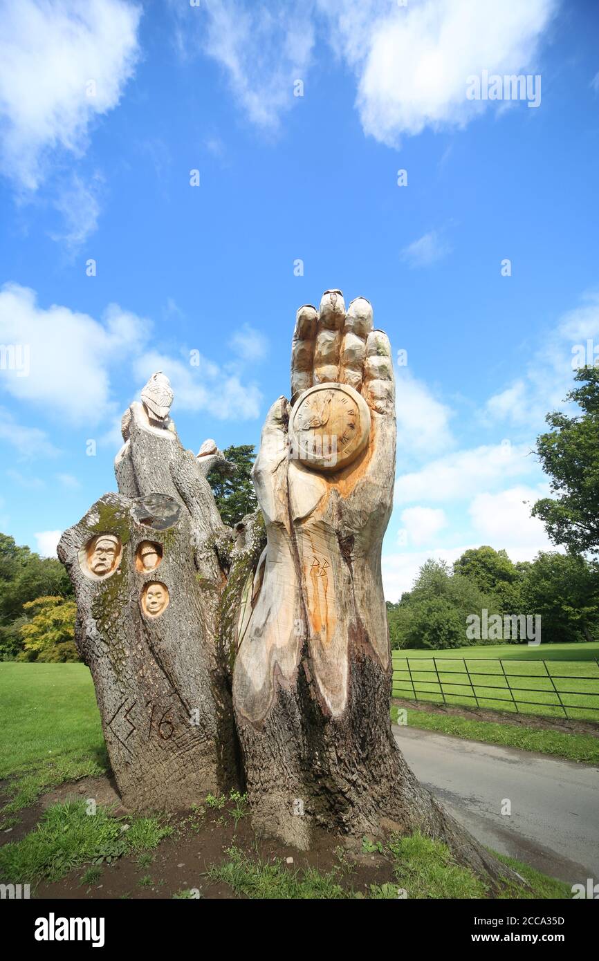 Carved tree with hand & clock at Rozelle Park, Ayr, Ayrshire Stock ...