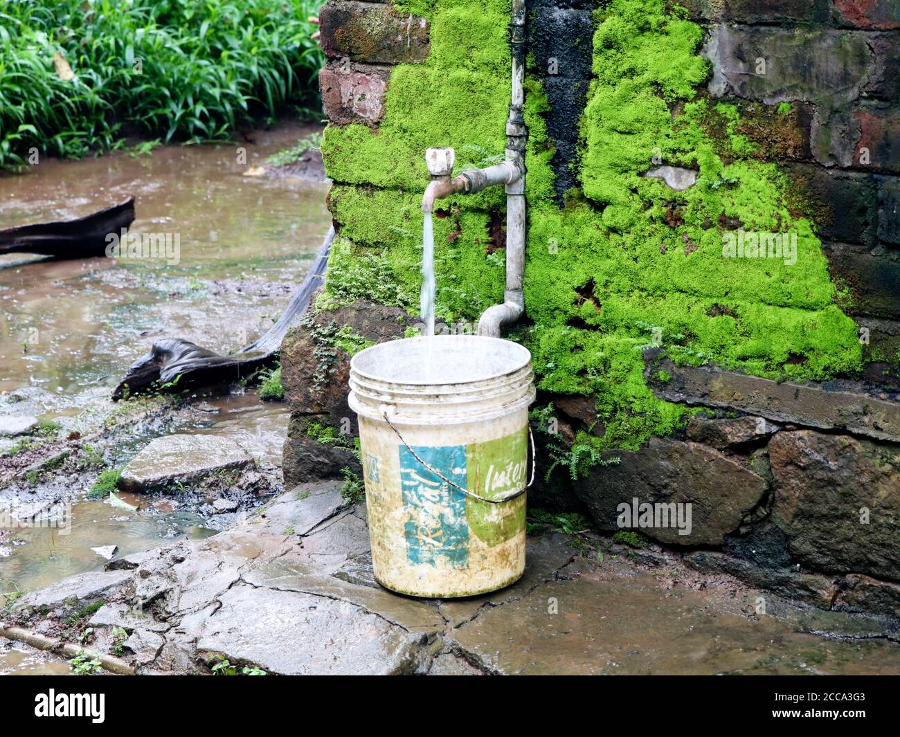Water flowing from an old plastic water tap, vintage Stock Photo - Alamy