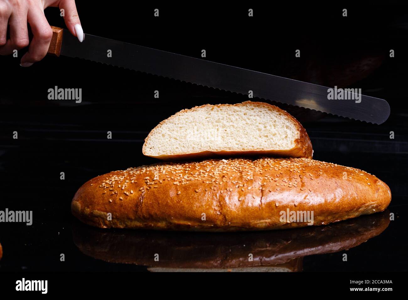 Woman eating white bread sandwich hi-res stock photography and images ...