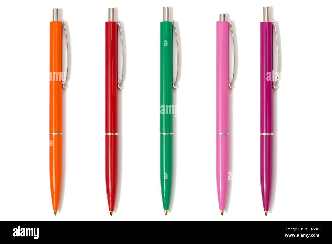 Five pens on the white isolated background. Top view Stock Photo - Alamy