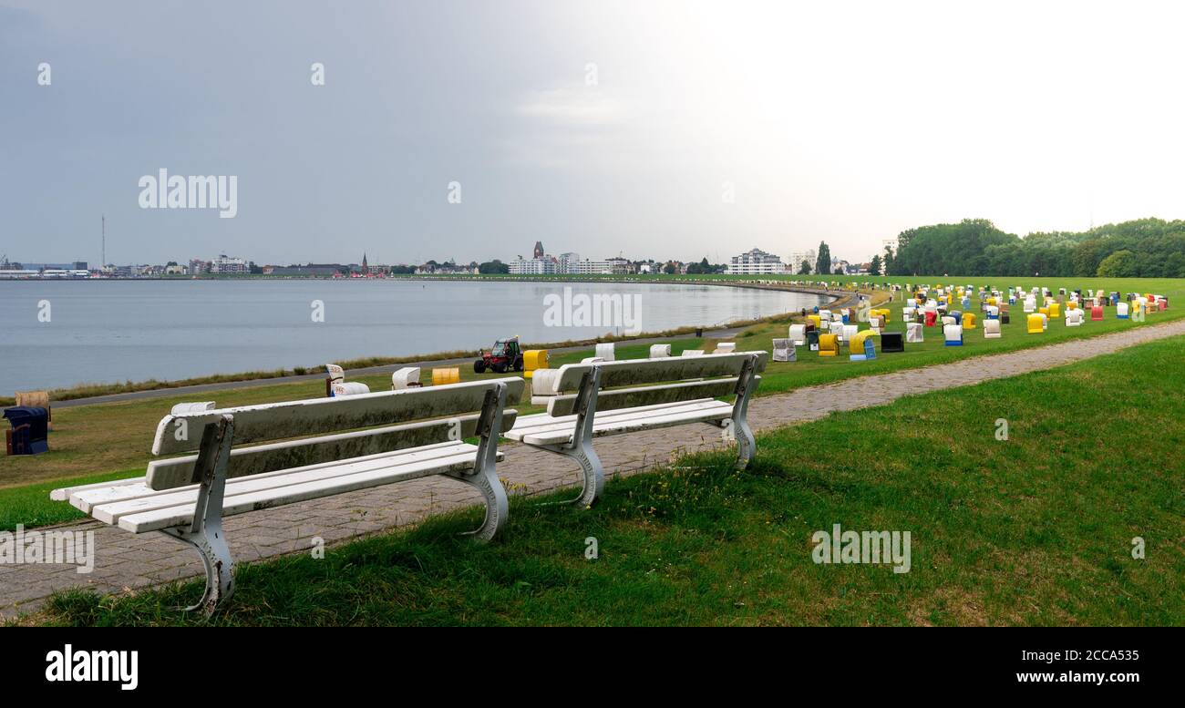 Park bench on top of a dike at the beach of Cuxhaven, Germany Stock ...