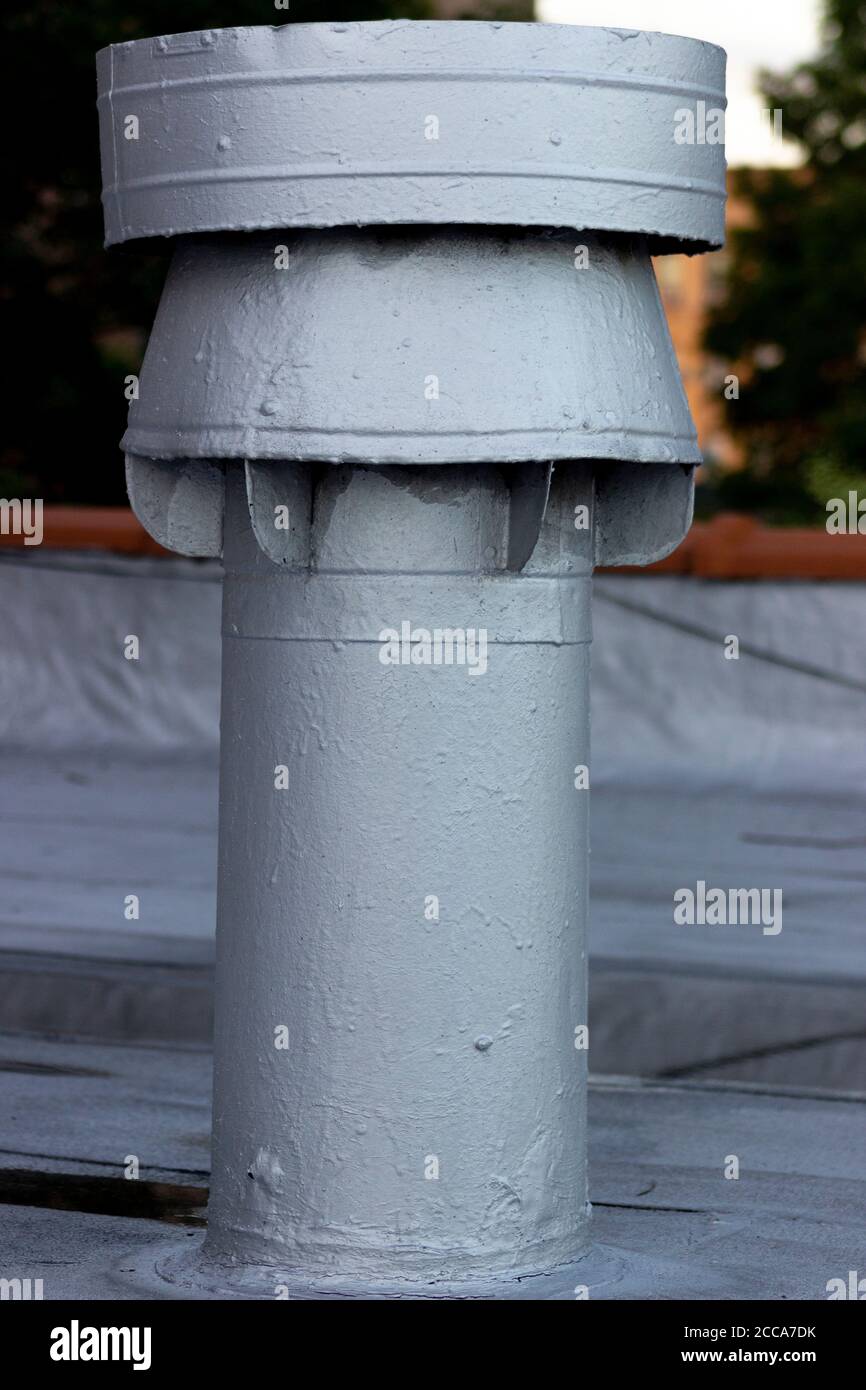 Protruding exterior end of an interior steam pipe ventilation fixture ...