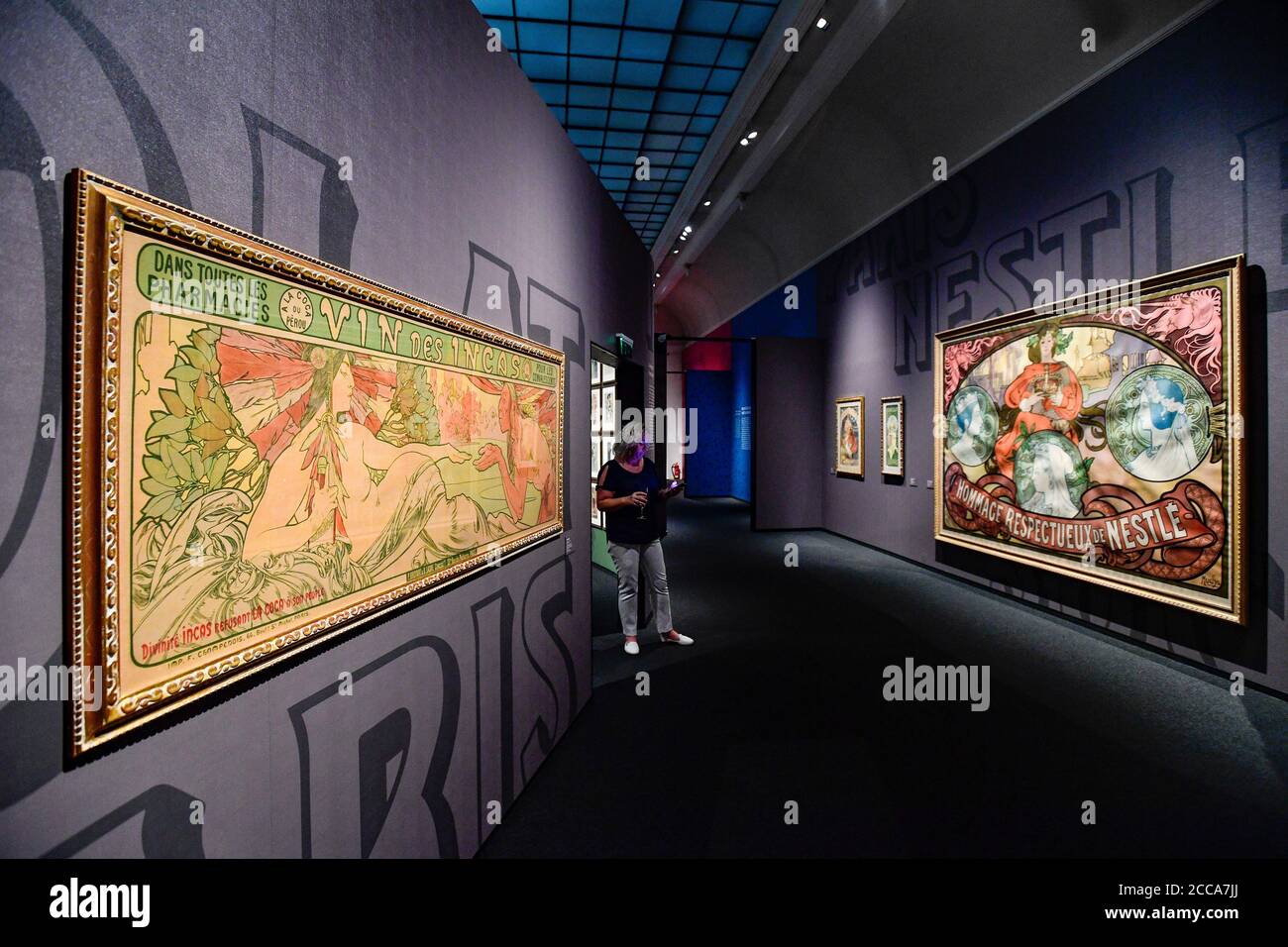 A visitor walks through the exhibition iMucha - Famous Collection In ...