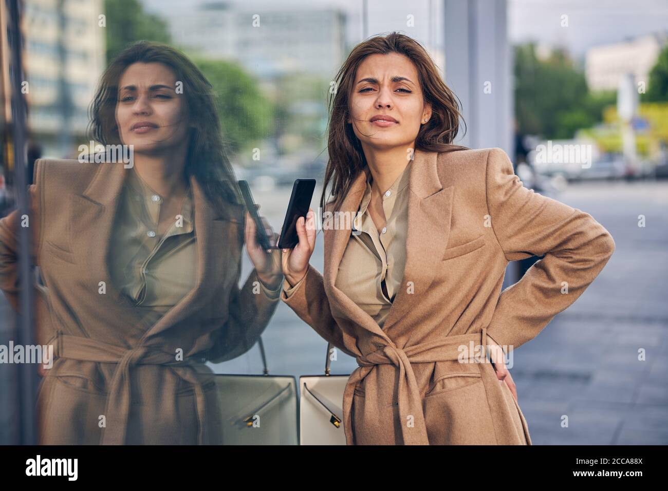 Brunette Caucasian female feeling bad outside in spring Stock Photo - Alamy