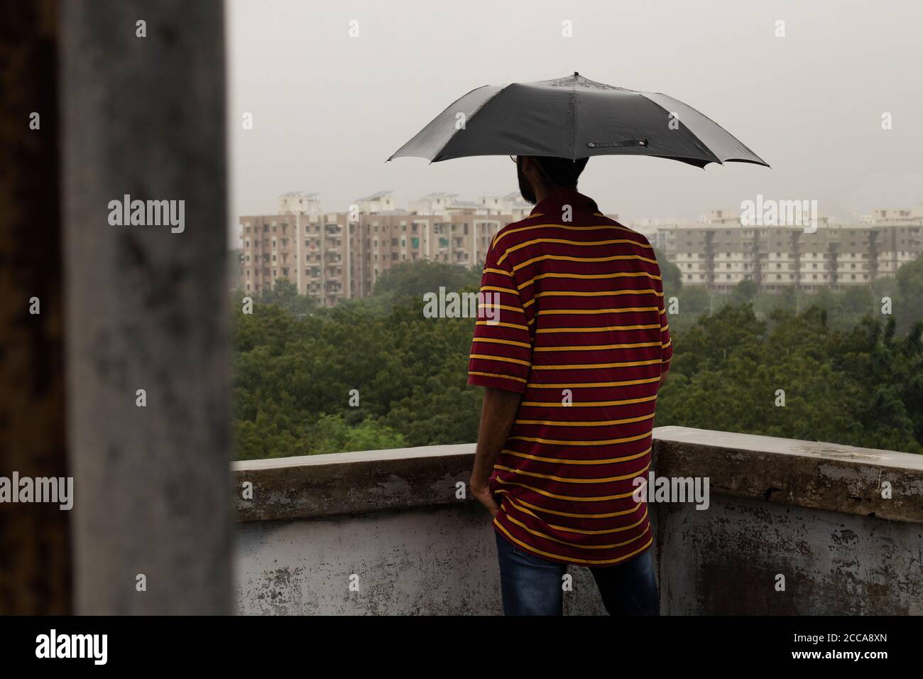 Guy Standing In The Rain