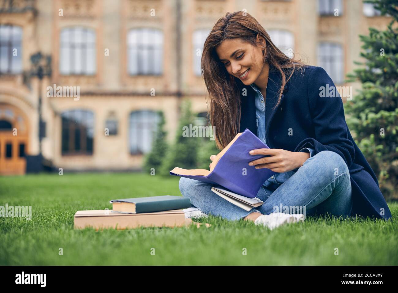 Attractive female student in casual clothes outside Stock Photo - Alamy