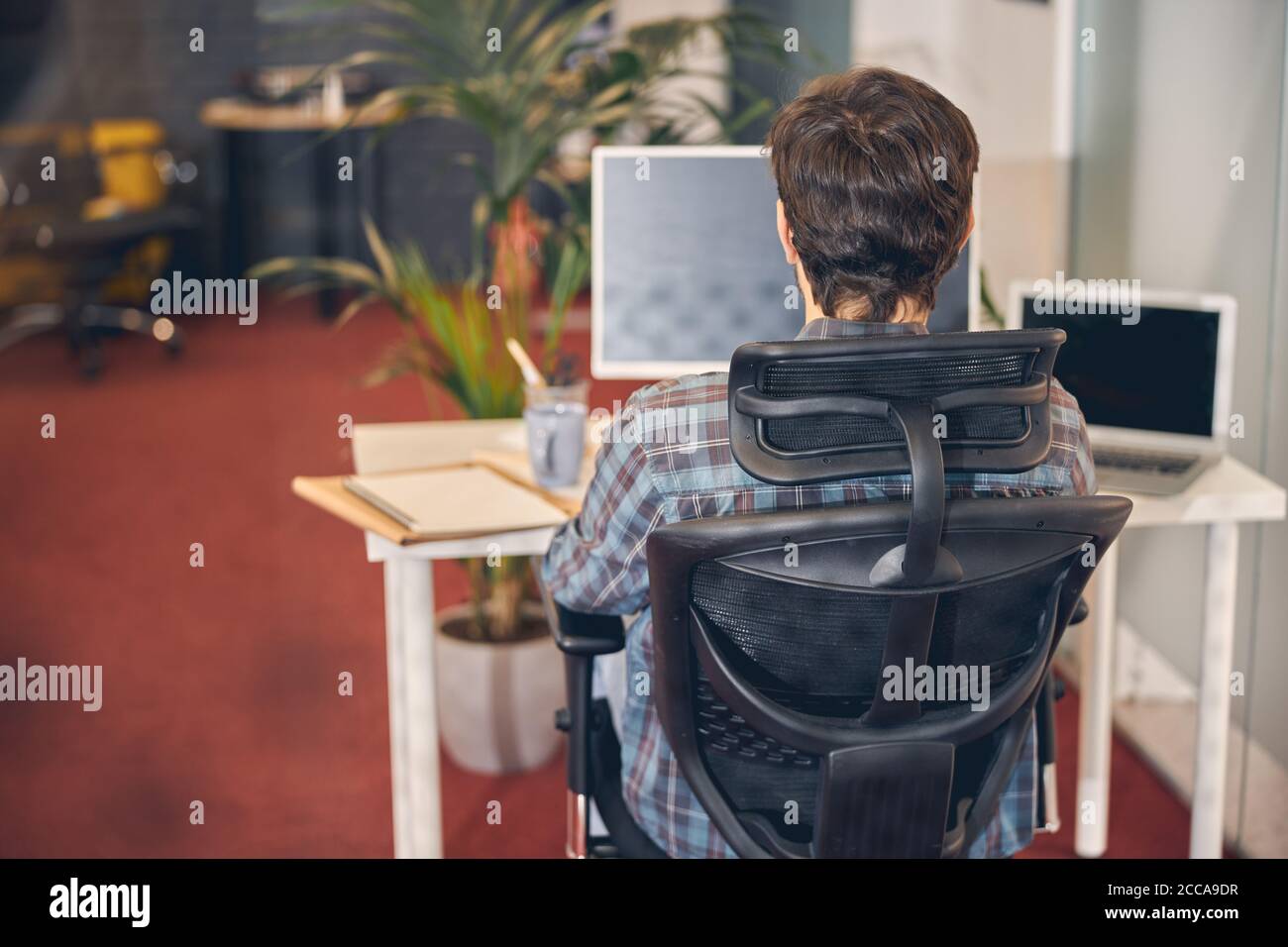 Male worker using computer in modern office Stock Photo - Alamy