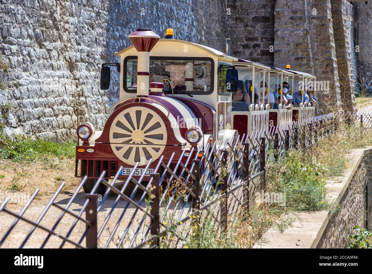 Train at street in Carcassonne medieval fortress. The fortress was ...