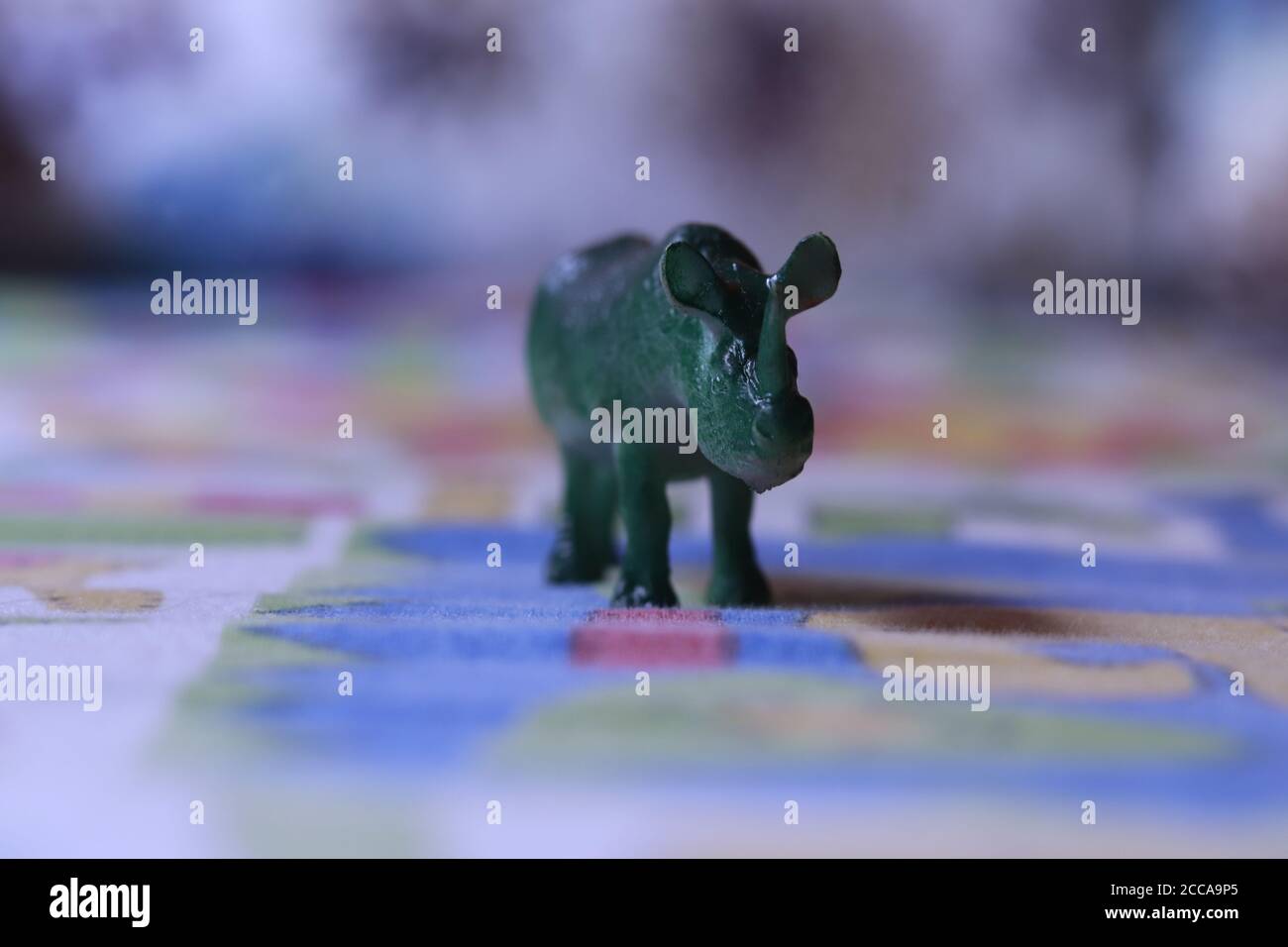rhino model concept toy on colorful background Stock Photo - Alamy
