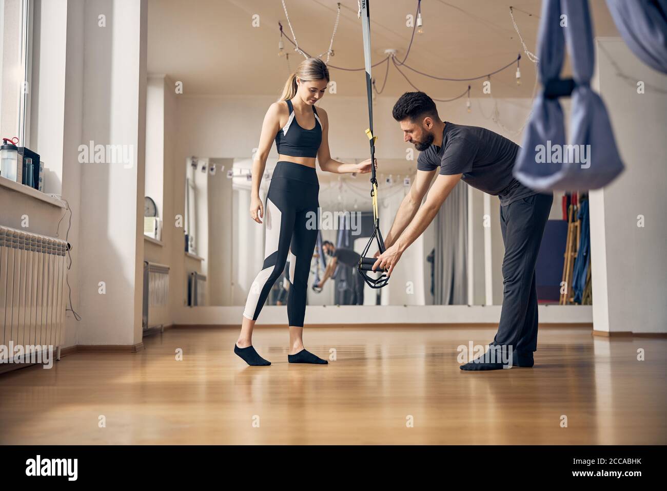 Cute young blonde personal trainer hi-res stock photography and images ...