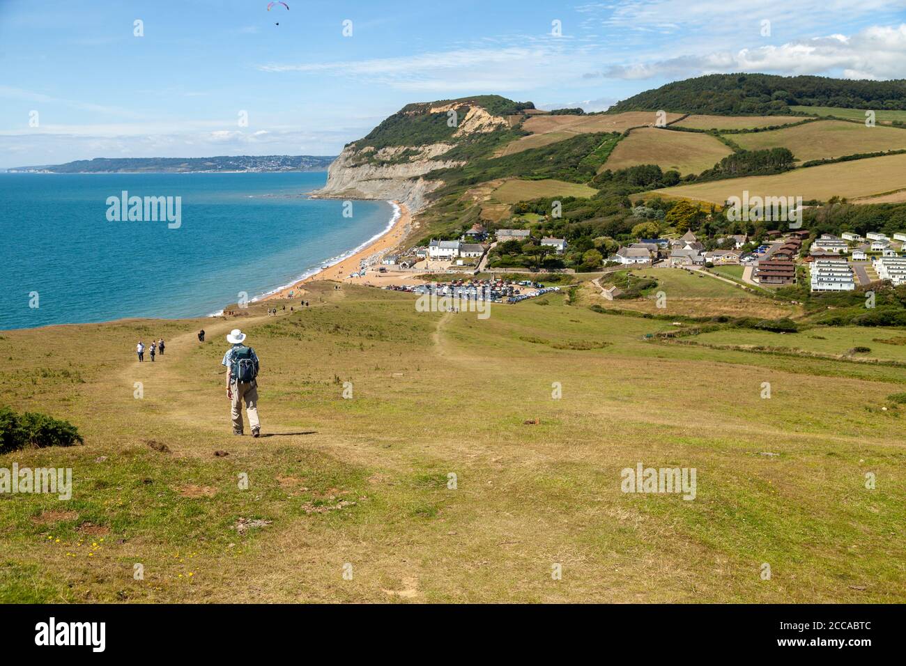 Walkers heading down to Eype mouth beach along the South West Coast ...
