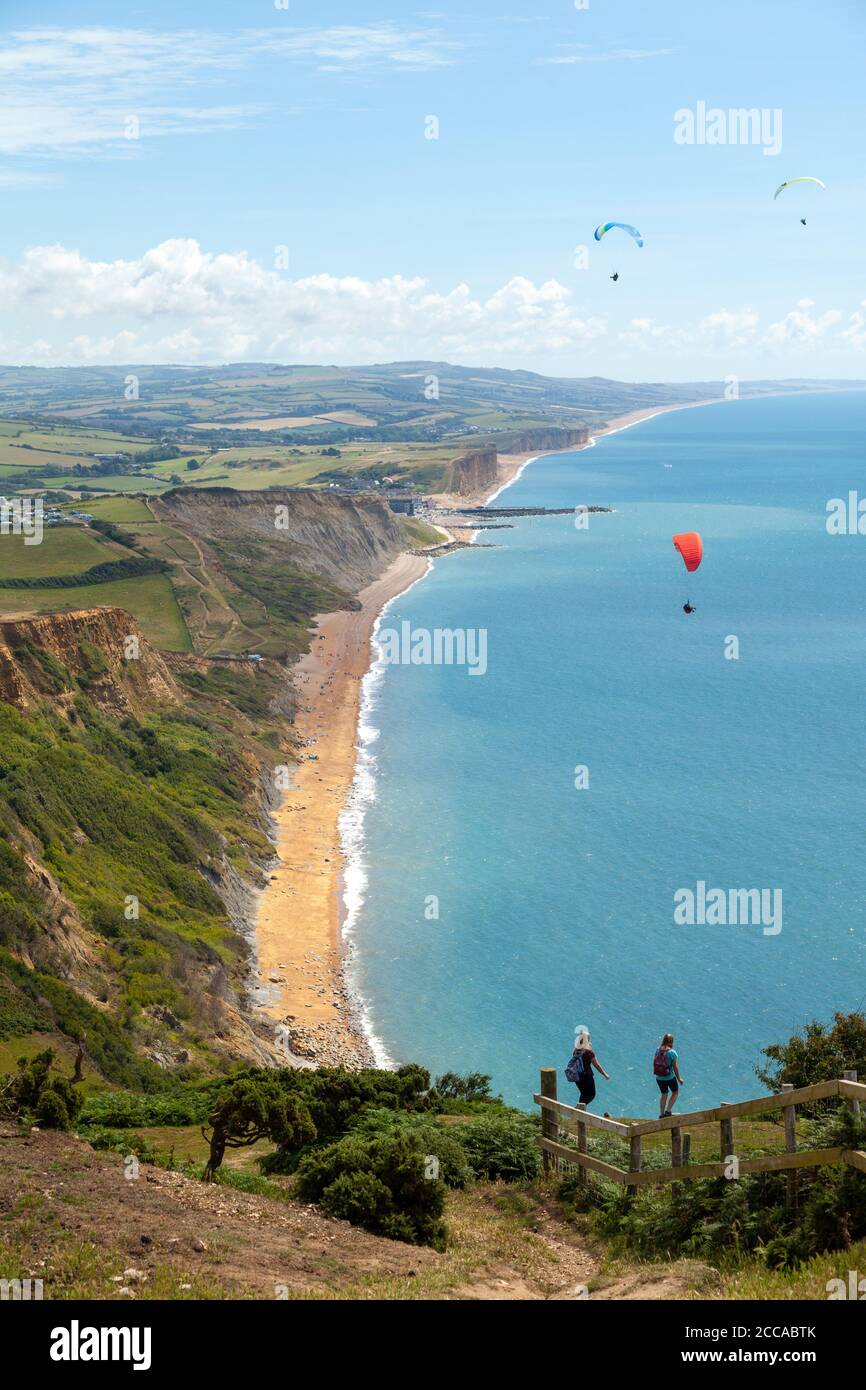 Walkers heading towards West Bay from the cliff top of Thorncombe ...
