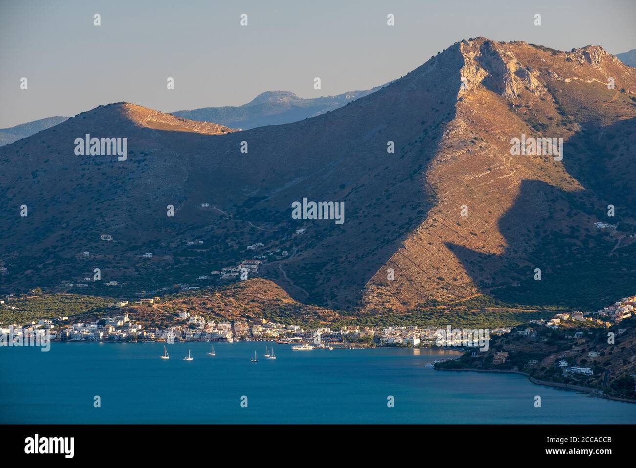 Village of Elounda at foot of mountain, northern Crete Stock Photo - Alamy