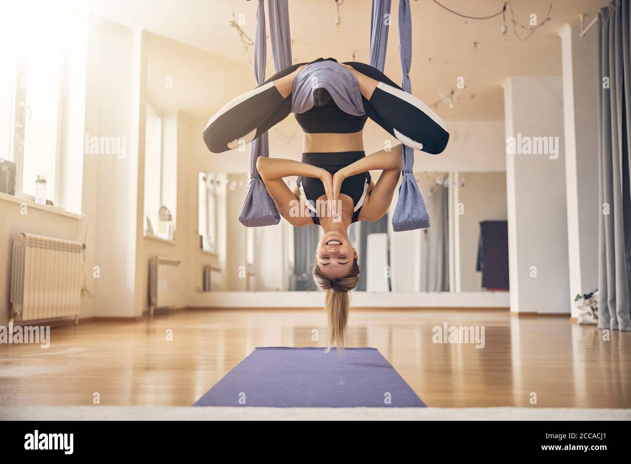 Woman hanging upside down in hi-res stock photography and images - Alamy