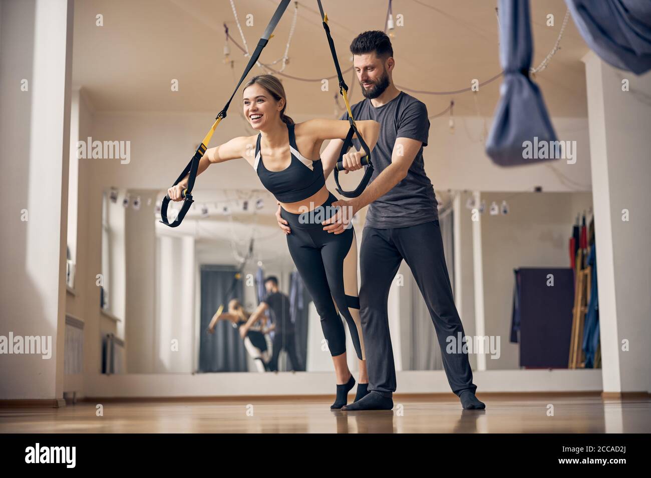 Woman working out with a personal coach Stock Photo - Alamy