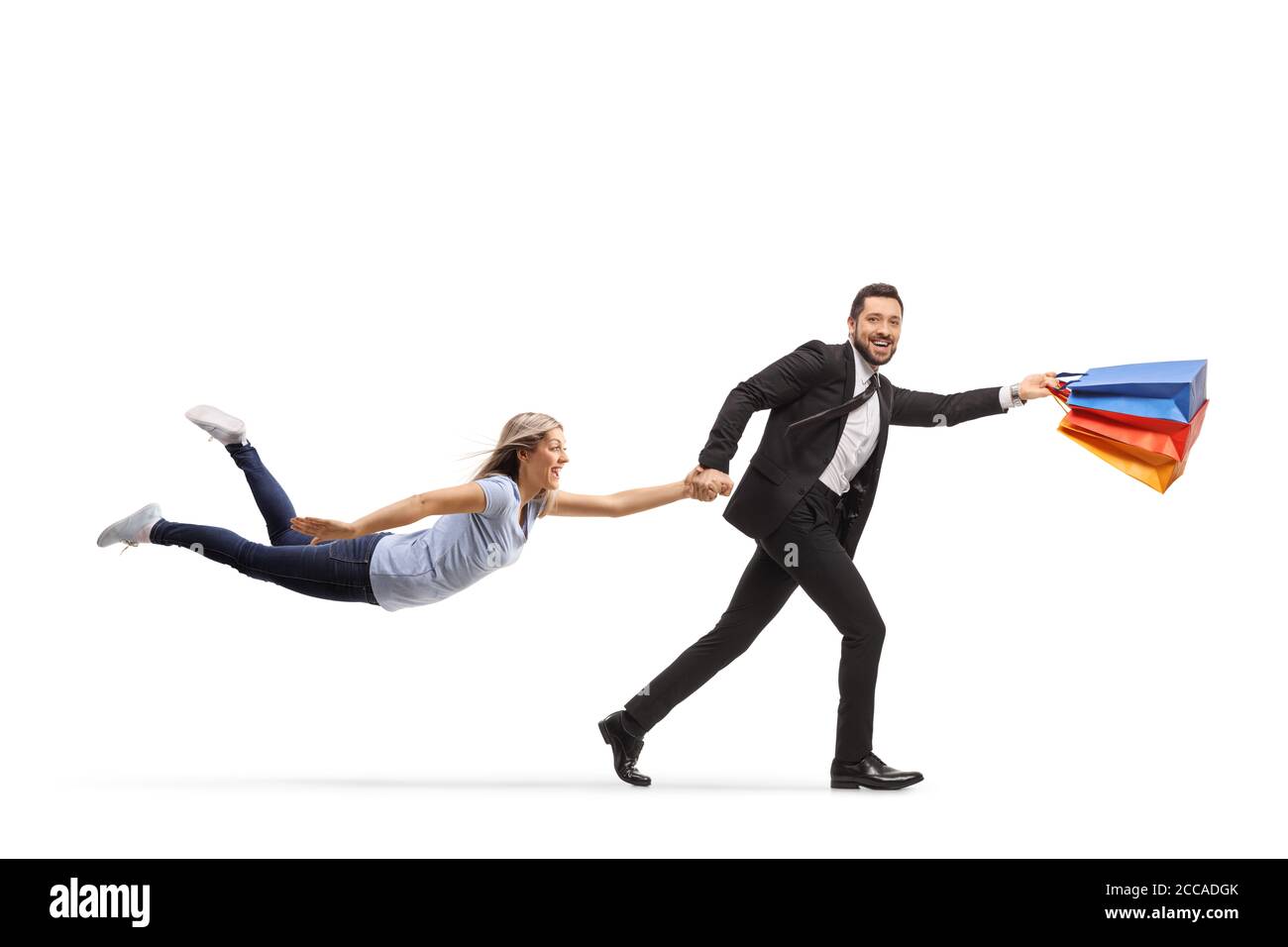 Man with shopping bags running and pulling a woman by the hand isolated ...