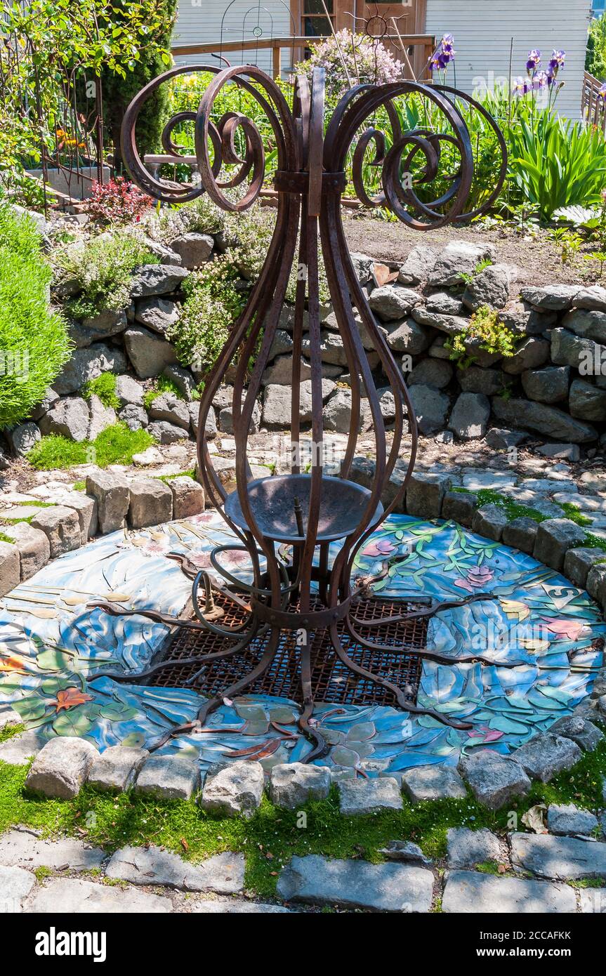 An artistic wrought iron fire pit at Belltown Cottage Park in Seattle ...