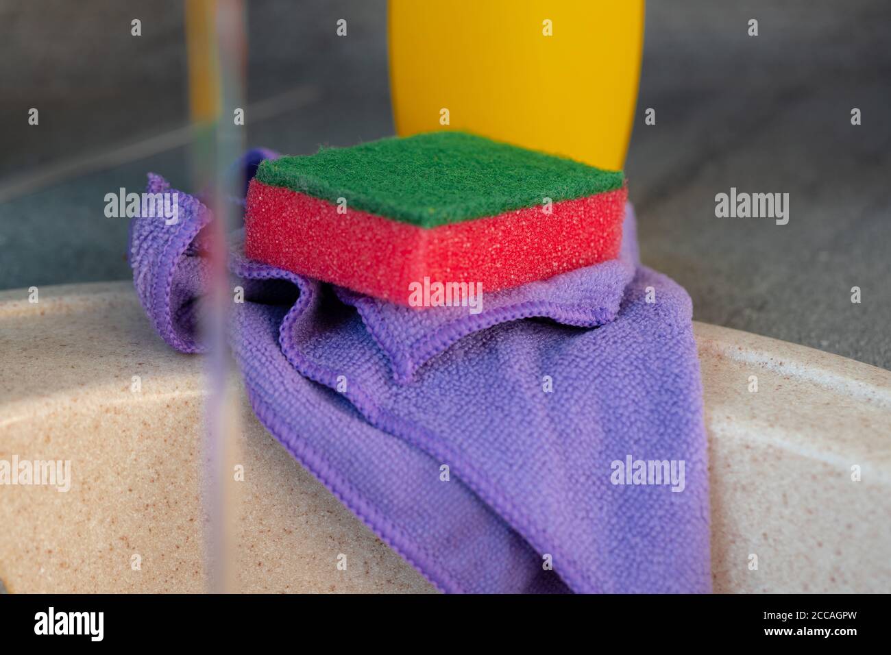 Cleaning sponge and rag on kitchen counter Stock Photo - Alamy