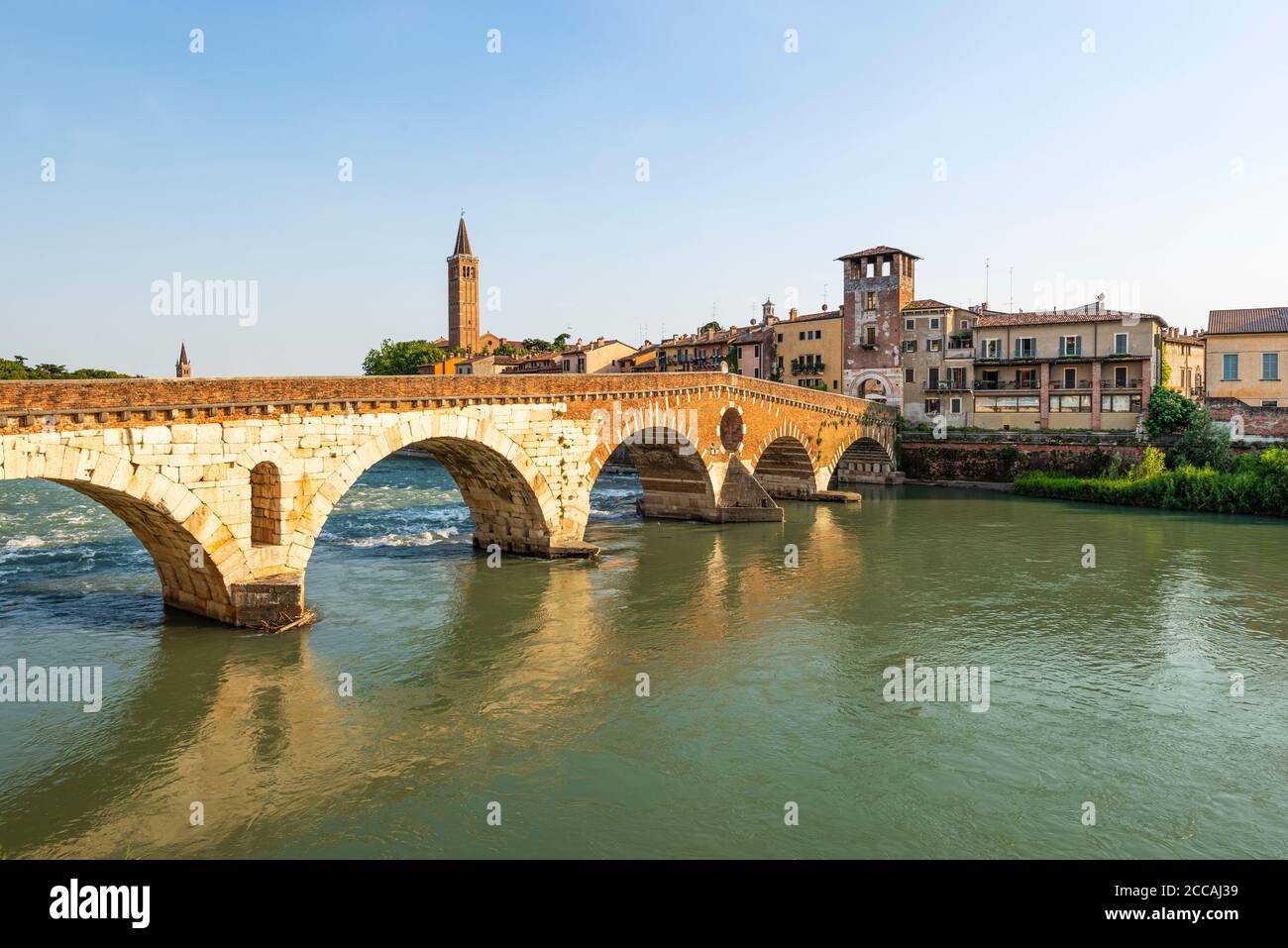 The Roman Ponte Pietra stone arch bridge over the river Adige in the ...