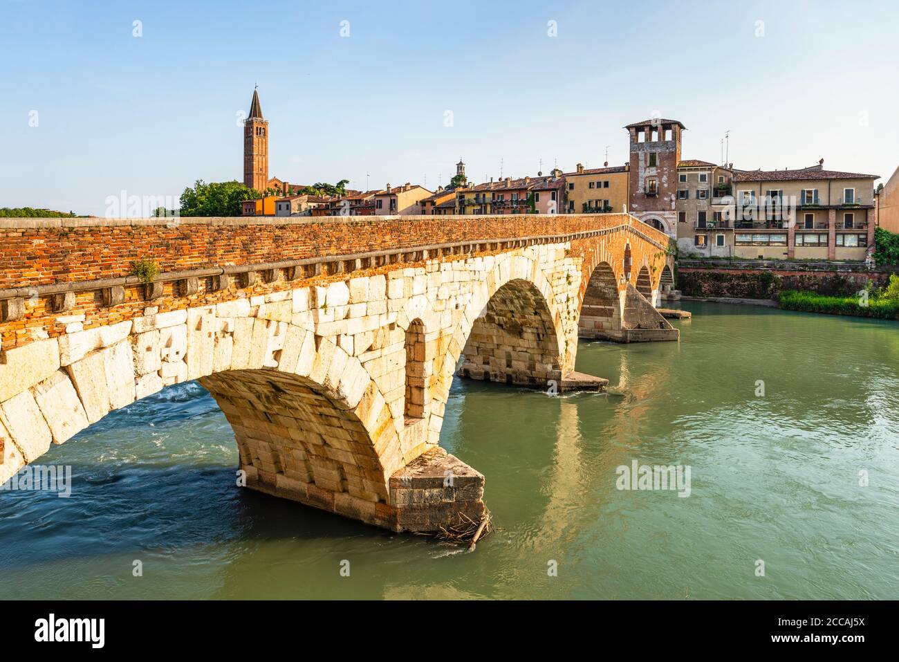The Roman Ponte Pietra stone arch bridge over the river Adige in the ...