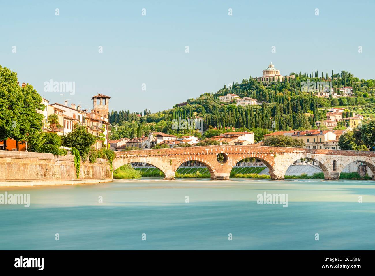 The Roman Ponte Pietra stone arch bridge over the Adige river in the ...