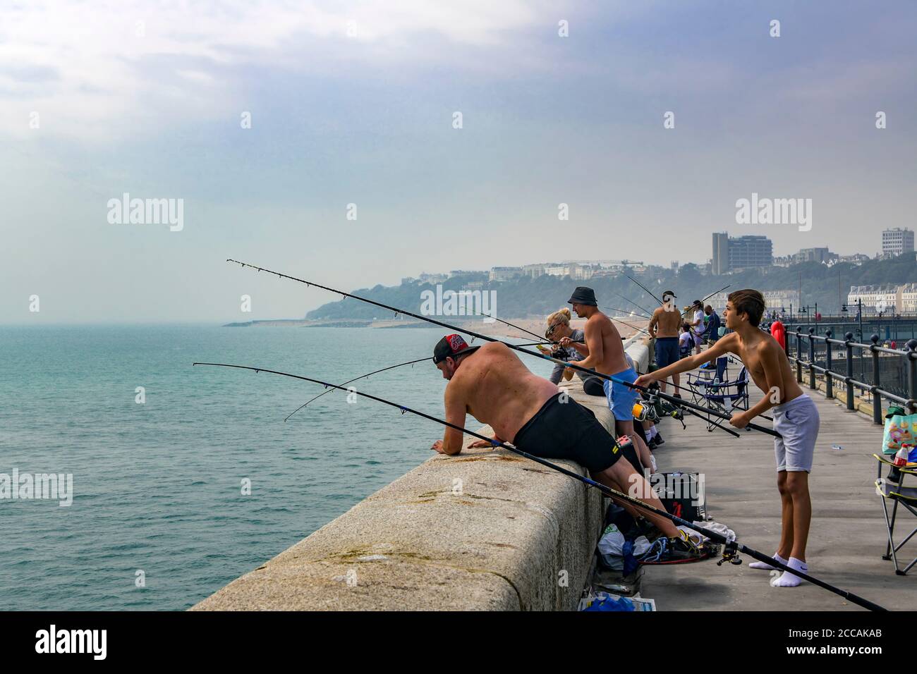 People fishing Folkestone Pier Kent England Stock Photo - Alamy