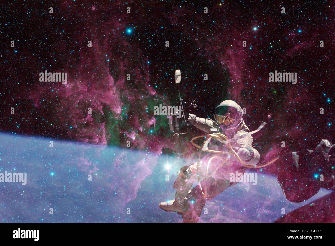 Astronaut. Nebula, cluster of stars in deep space. Science fiction art. Elements of this image ...